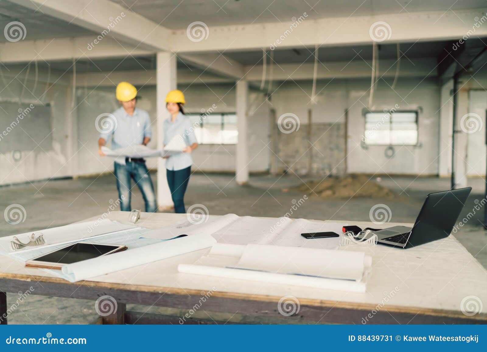 Blueprint, Laptop Computer, and Industrial Tools at Construction Site ...