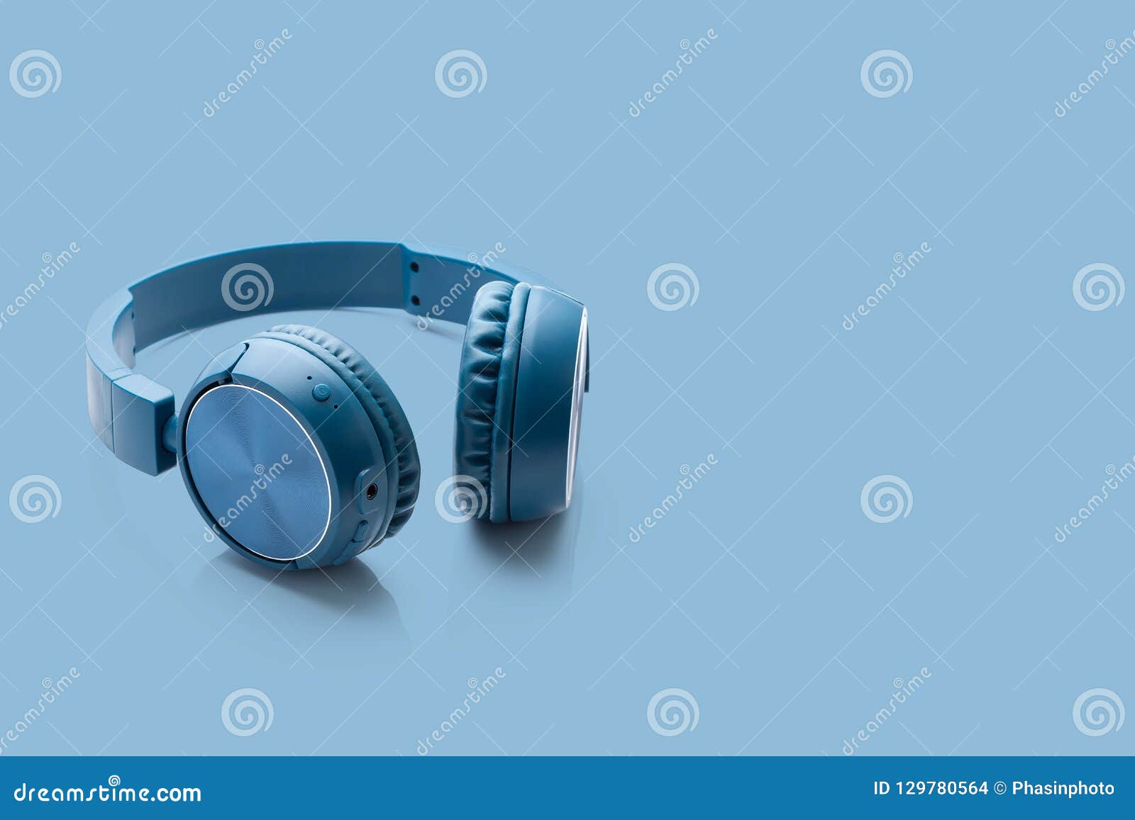 Bluetooth Blue Headphone on Blue Background Stock Photo - Image of ...