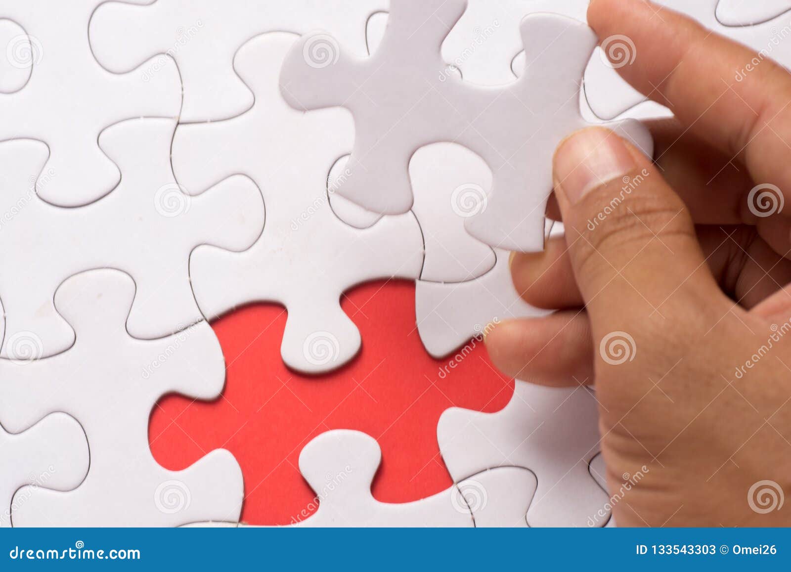 Blur Image Of Close Up Of Hand Placing The Last Jigsaw Puzzle Pi ...