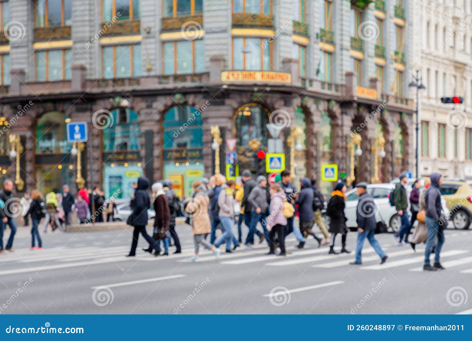 In the Blur of the Intersection Where a Group of People Cross the ...