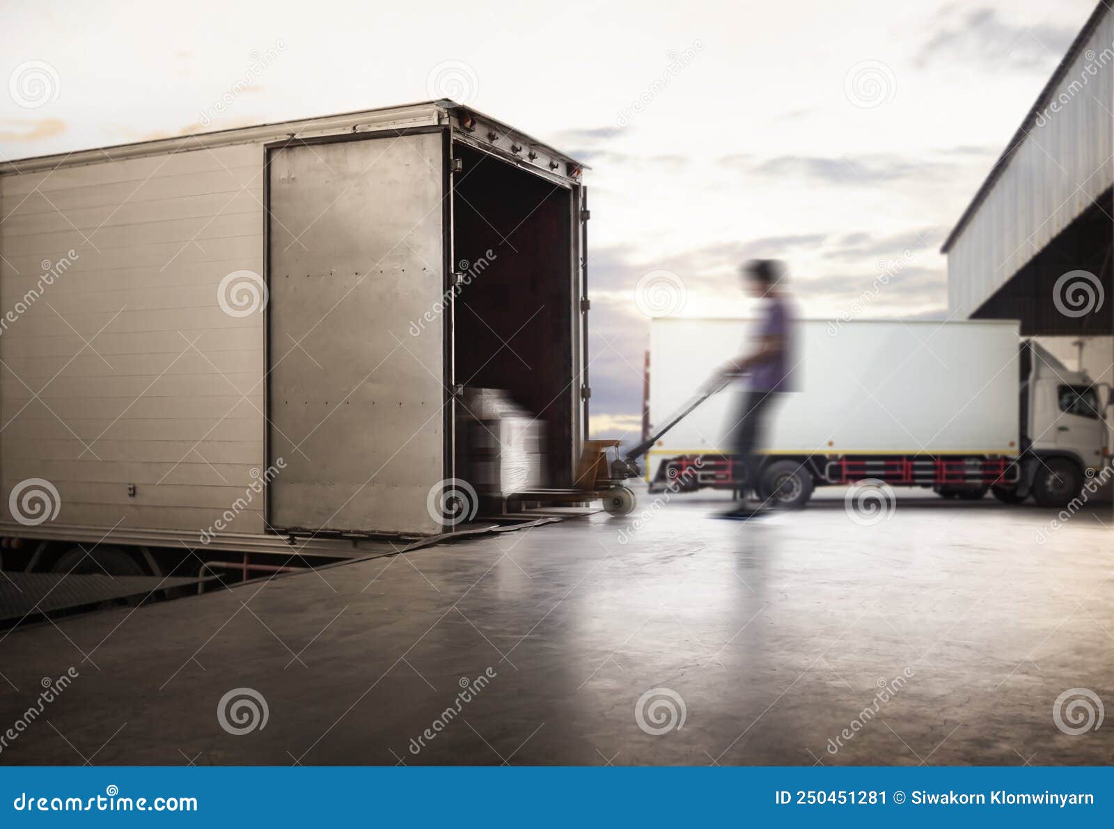 Blur Motion of Workers Unloading Cargo Pallets To the Cargo Container ...