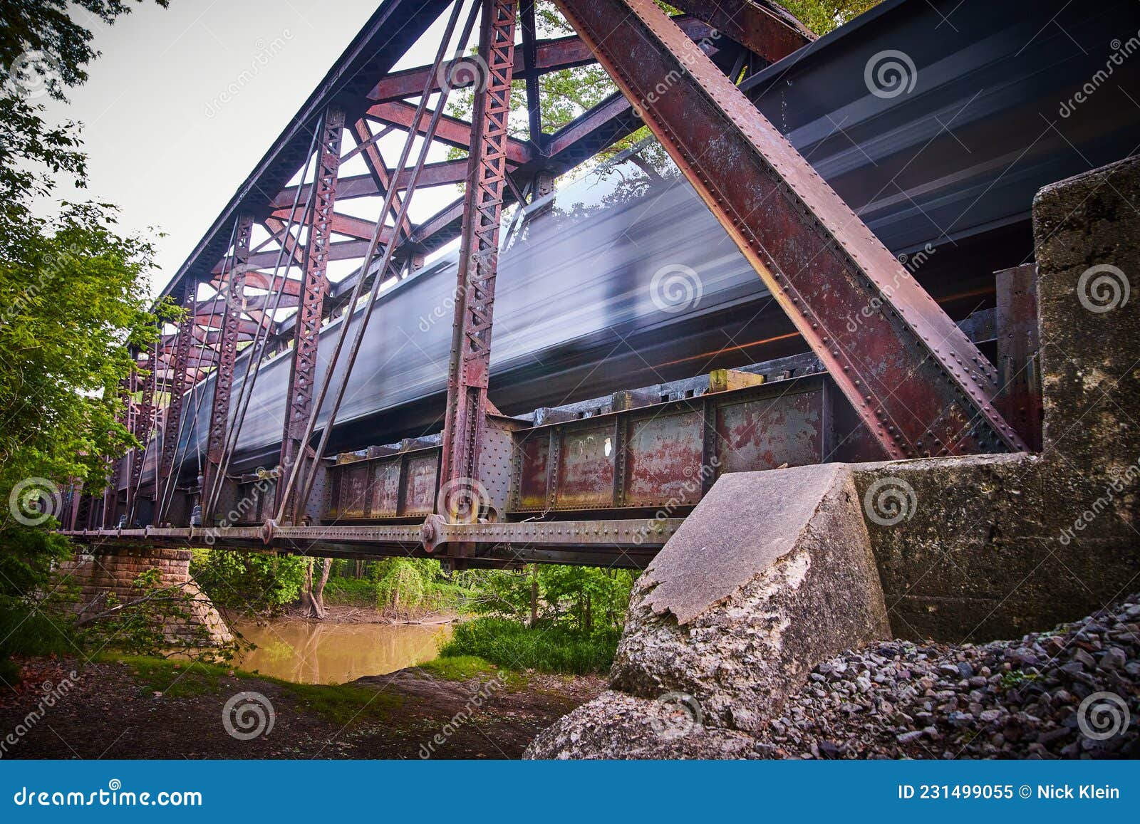Blur of Train Passing through Large Metal Bridge Stock Image - Image of ...