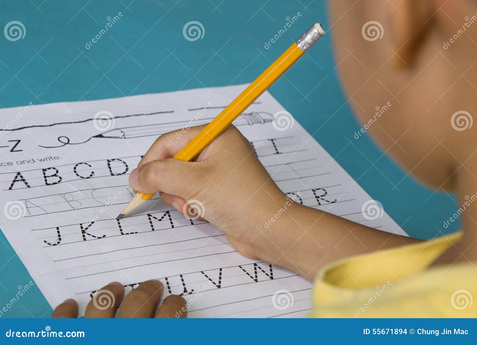 Blurred Asian Boys Face Tracing Letter L Stock Photo - Image of pencil ...
