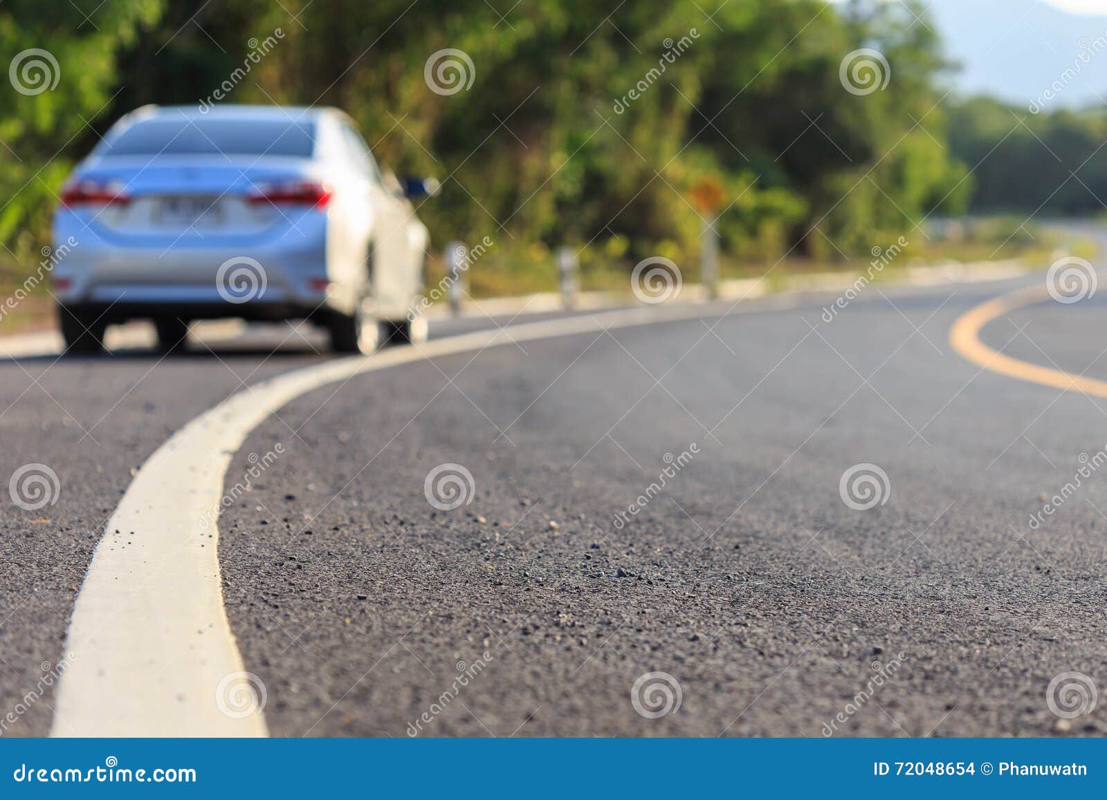 Blurred Back Side of New Silver Car Parking on the Asphalt Road Stock ...
