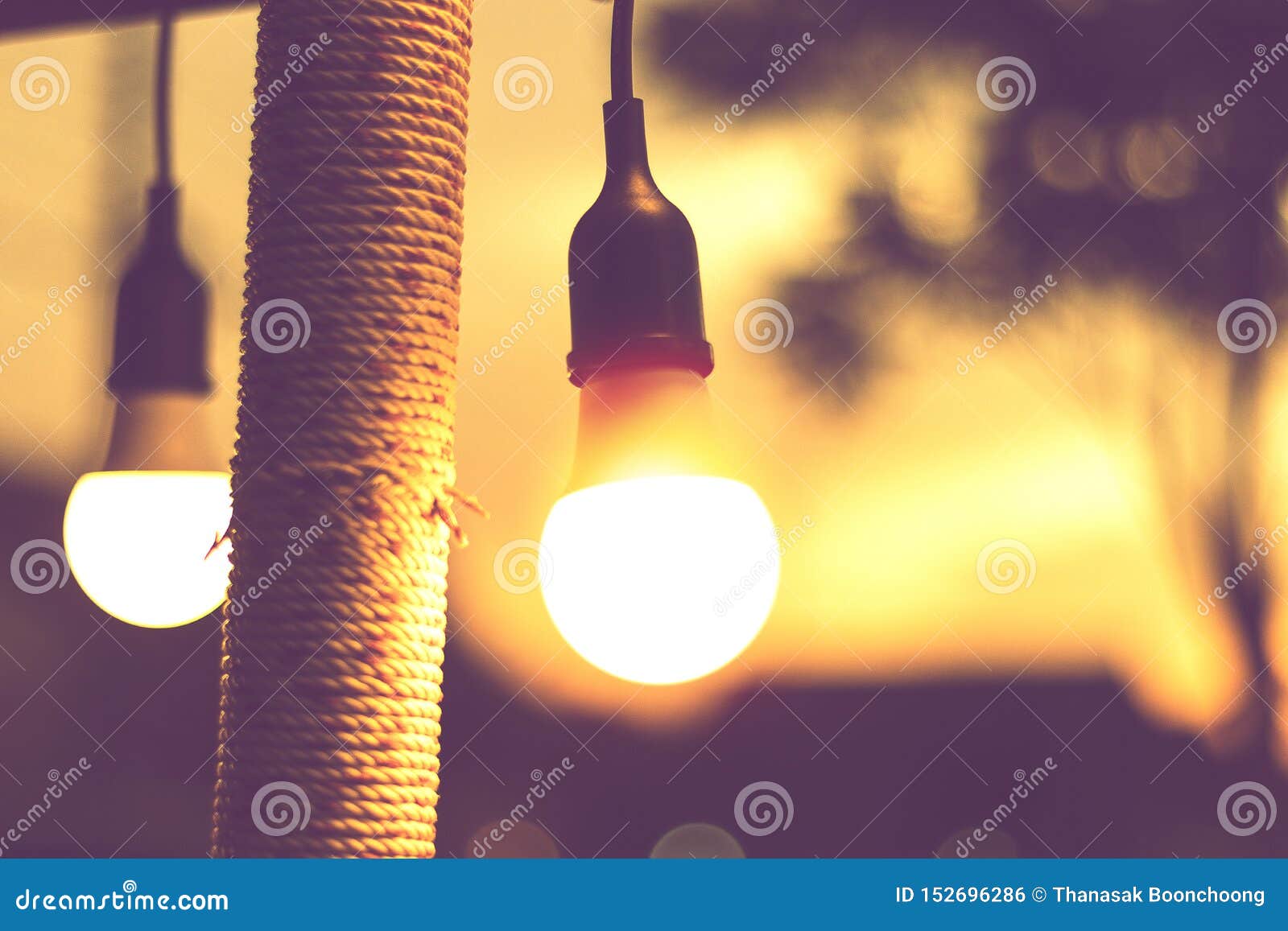 Blurred Light on Sunset with Yellow String Lights Decor in Beach ...