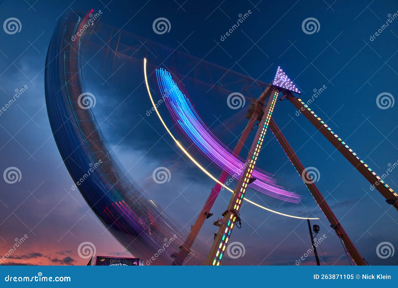Blurred Carnival Ride Swinging during Dusk Stock Image - Image of ...