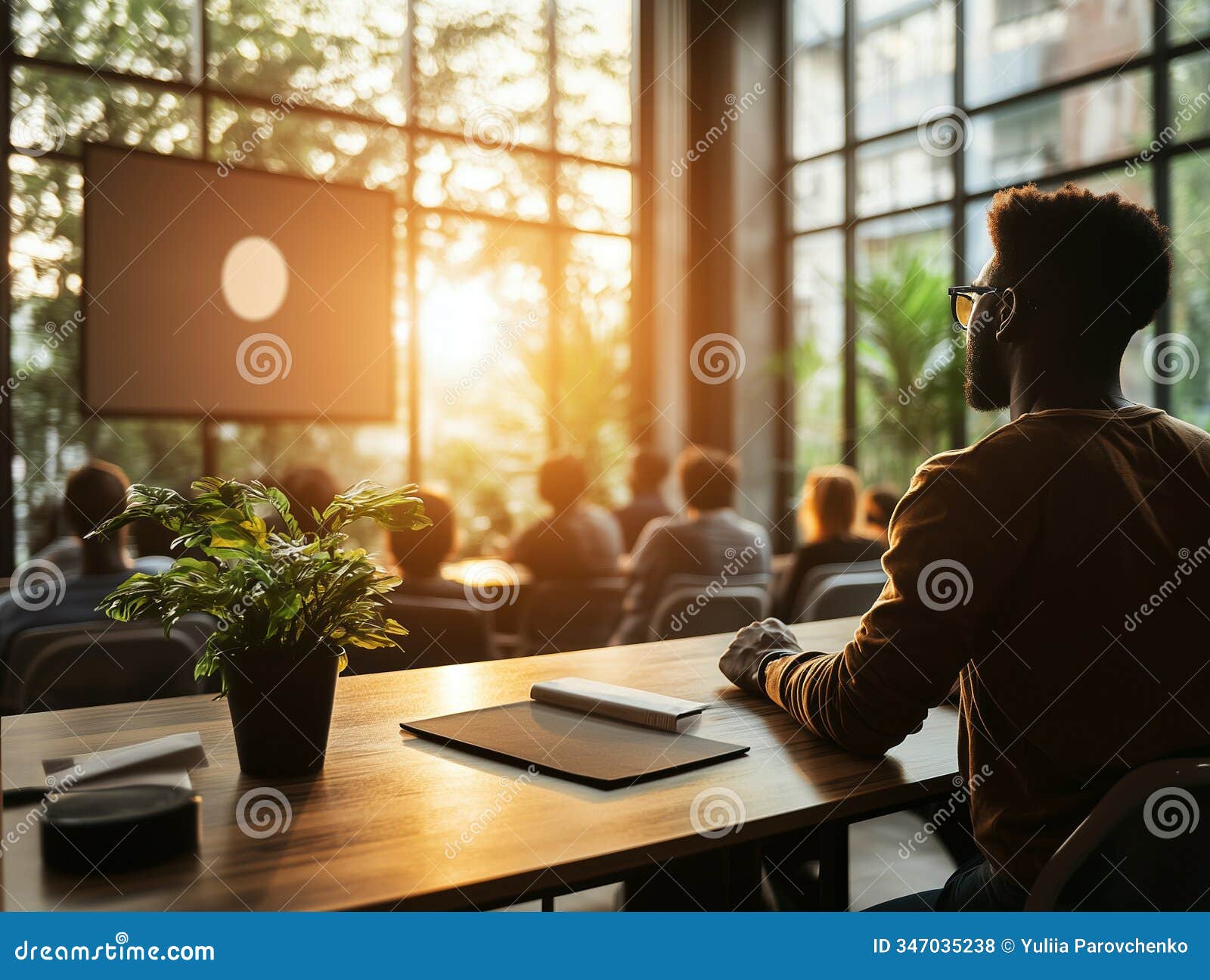 Blurred Classroom or Seminar Setting with a Speaker in the Background ...