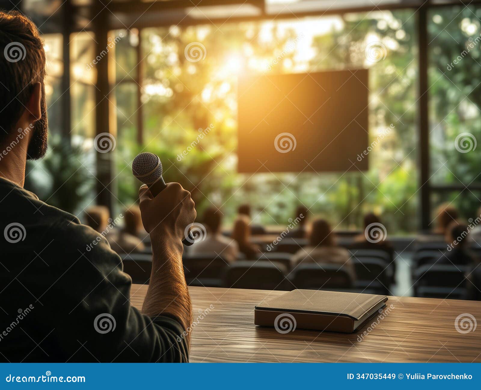 Blurred Classroom or Seminar Setting with a Speaker in the Background ...