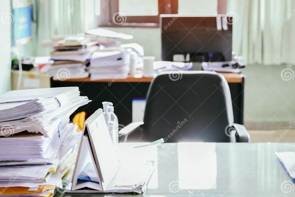 Blurred of Cluttered Desk, Full of Documents a Mess Desk with Many ...