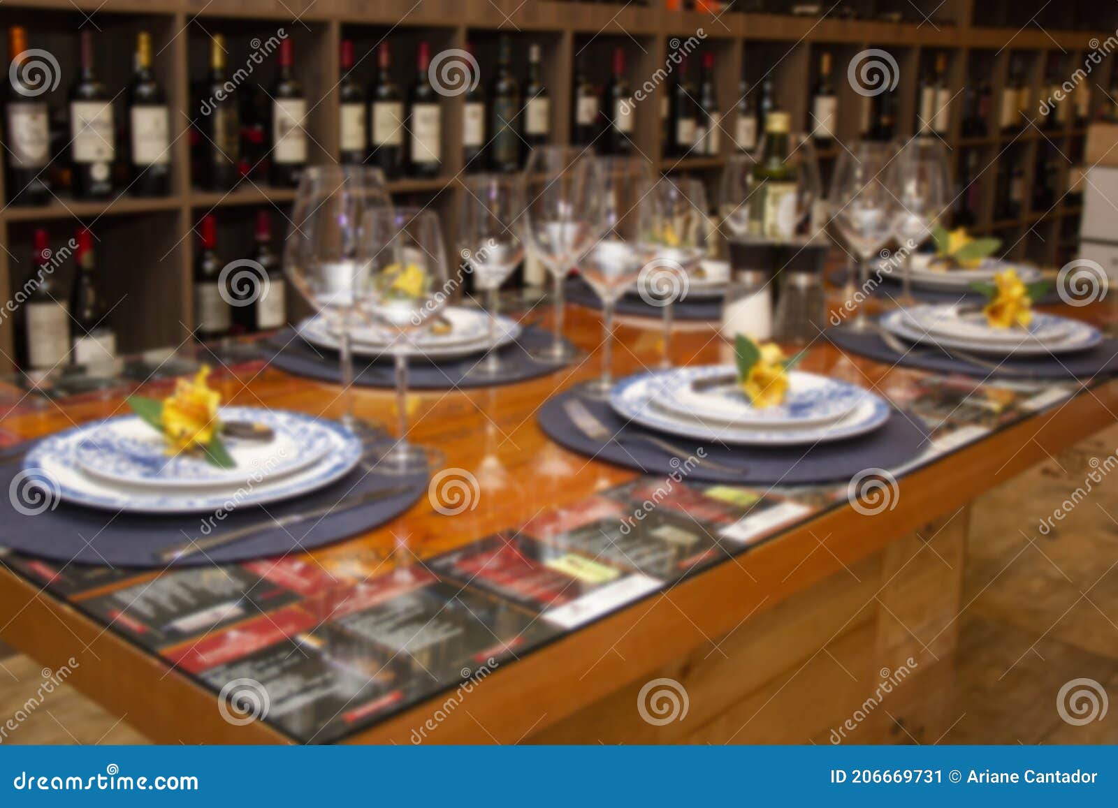 Blurred Dining Table with Bowls and Dishes Set for Dinner and Wine ...