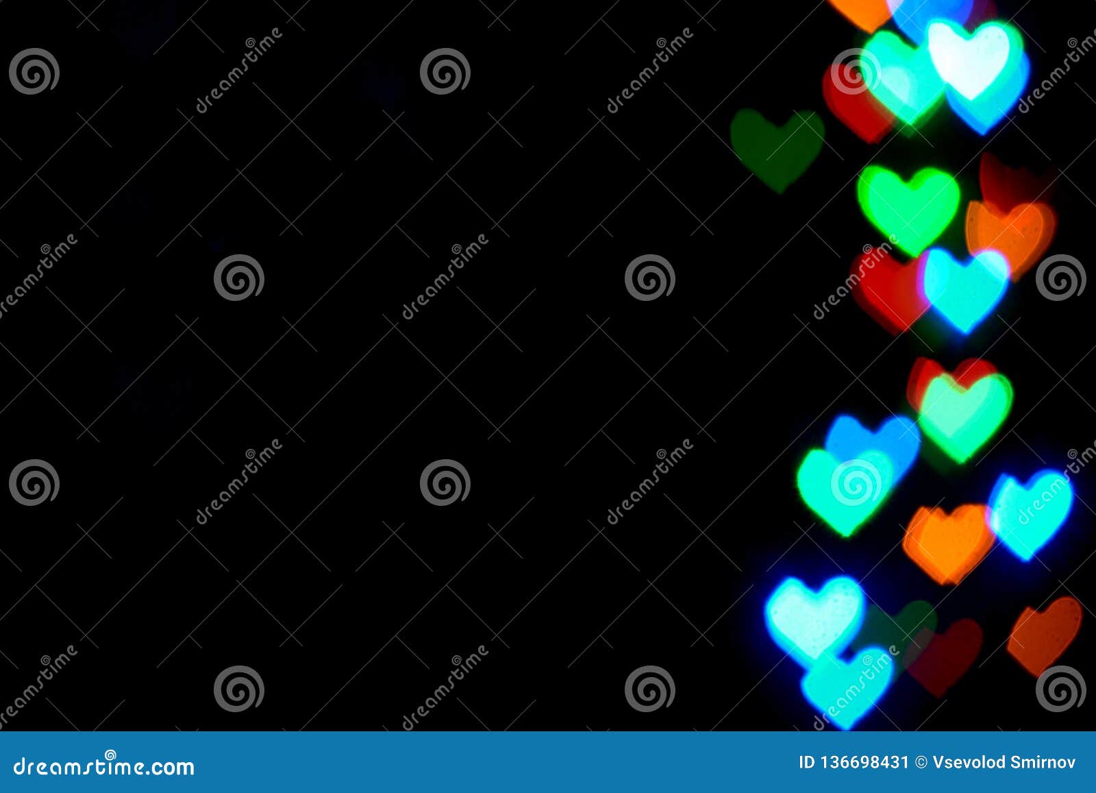Multi Colored Blurred Lights in the Shape of Hearts in the Dark Stock ...