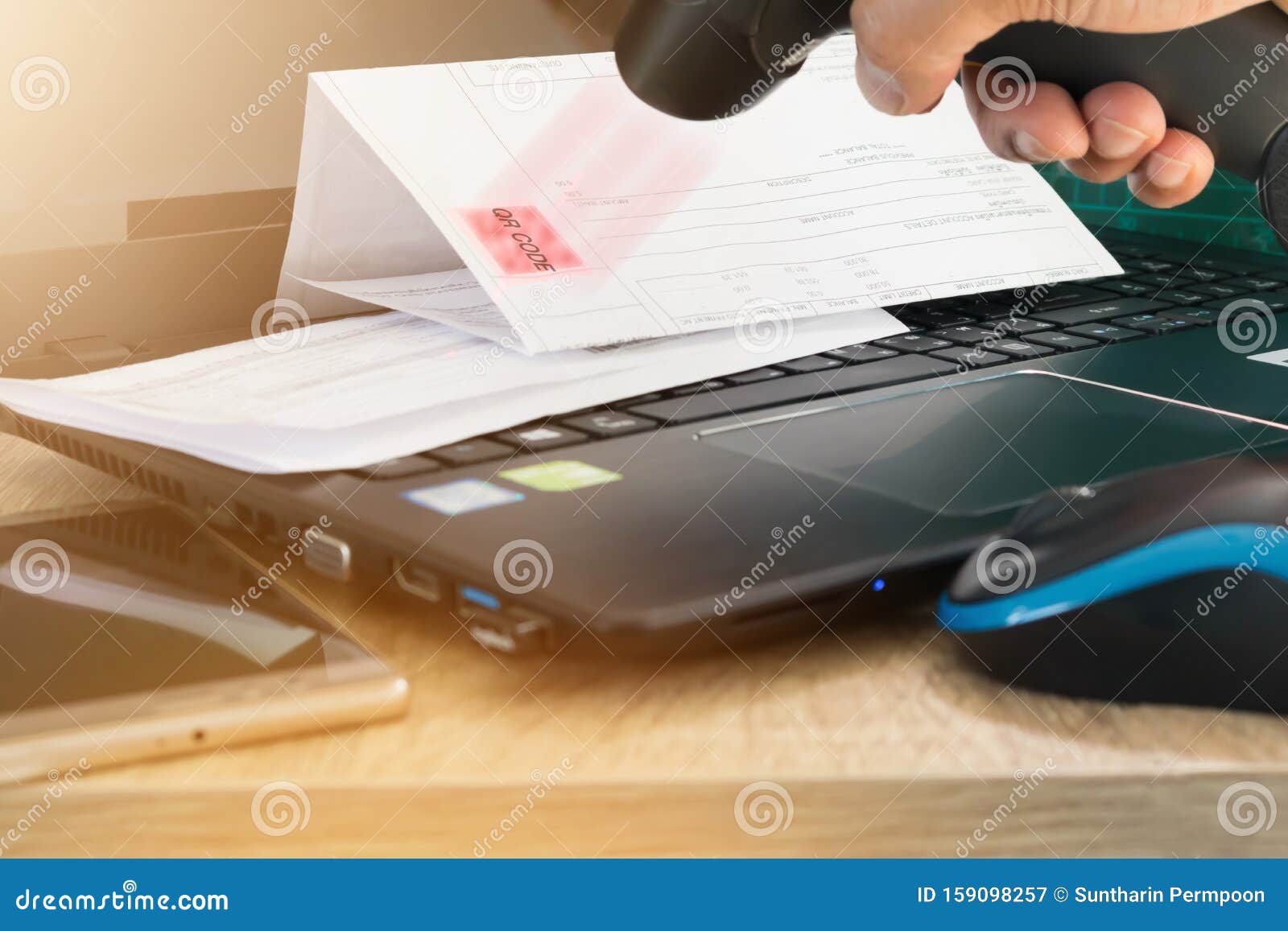 Blurred Image Hand Holding Barcode Reader Focus To QR Code on Paper ...