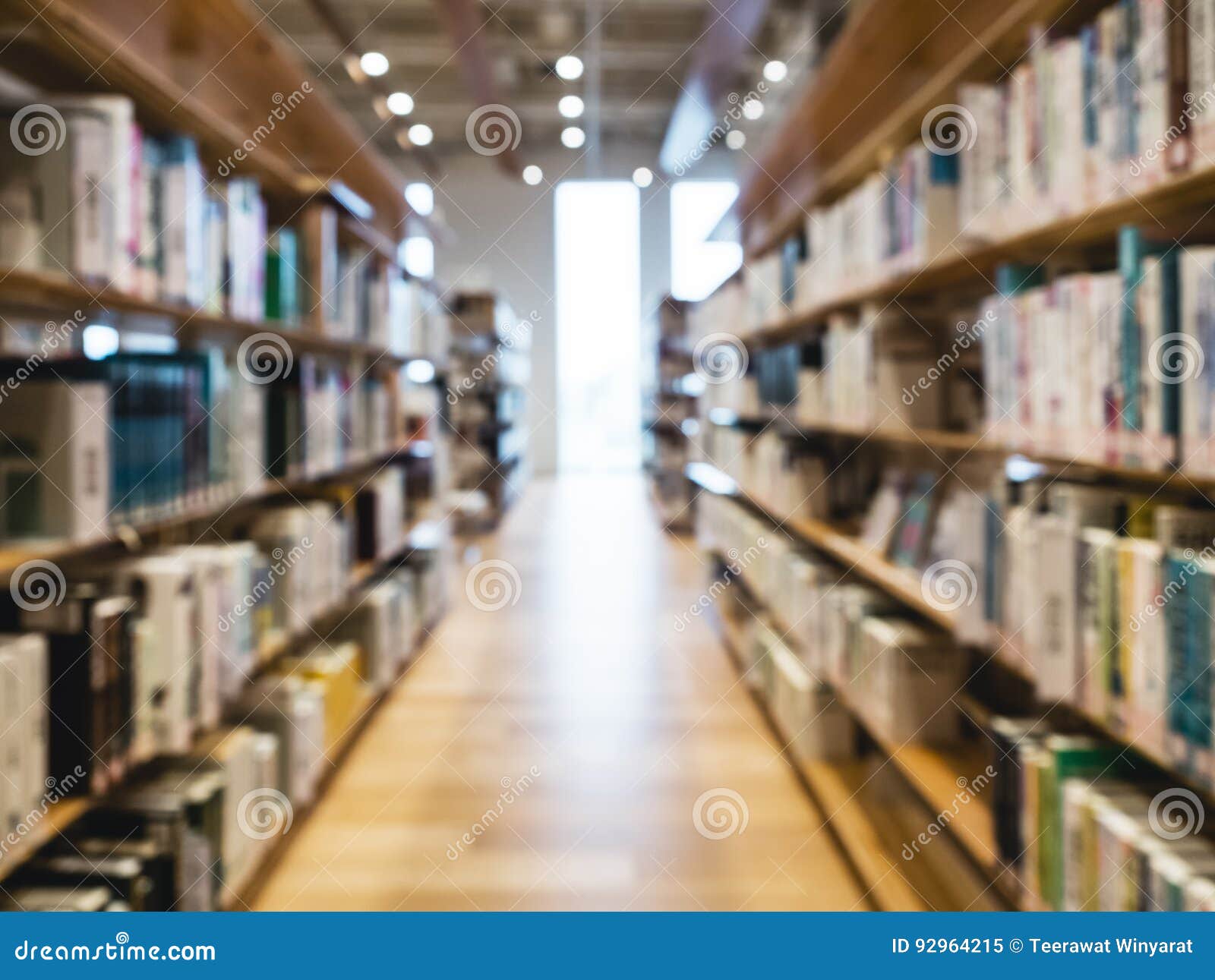Blurred Library Aisle With Focused Bookshelves And Wooden Floor. Stock ...