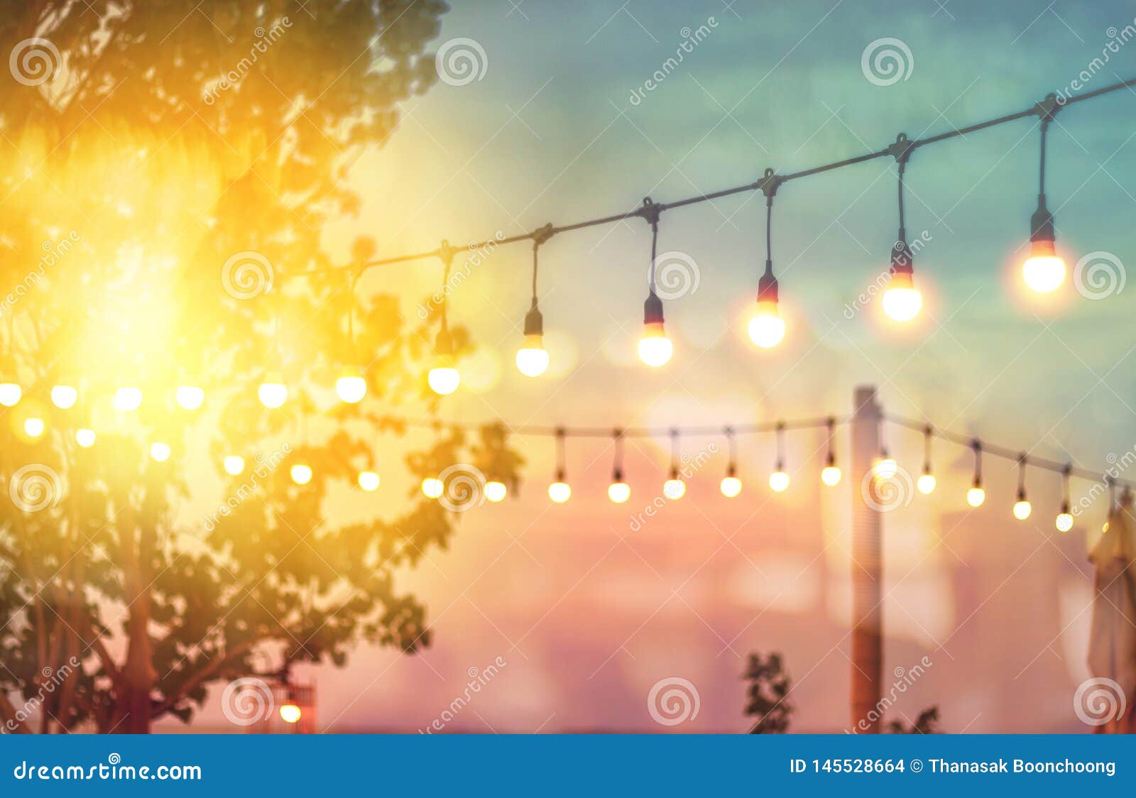 Blurred Light on Sunset with String Lights Decor in Beach Restaurant Stock Photo - Image of ...