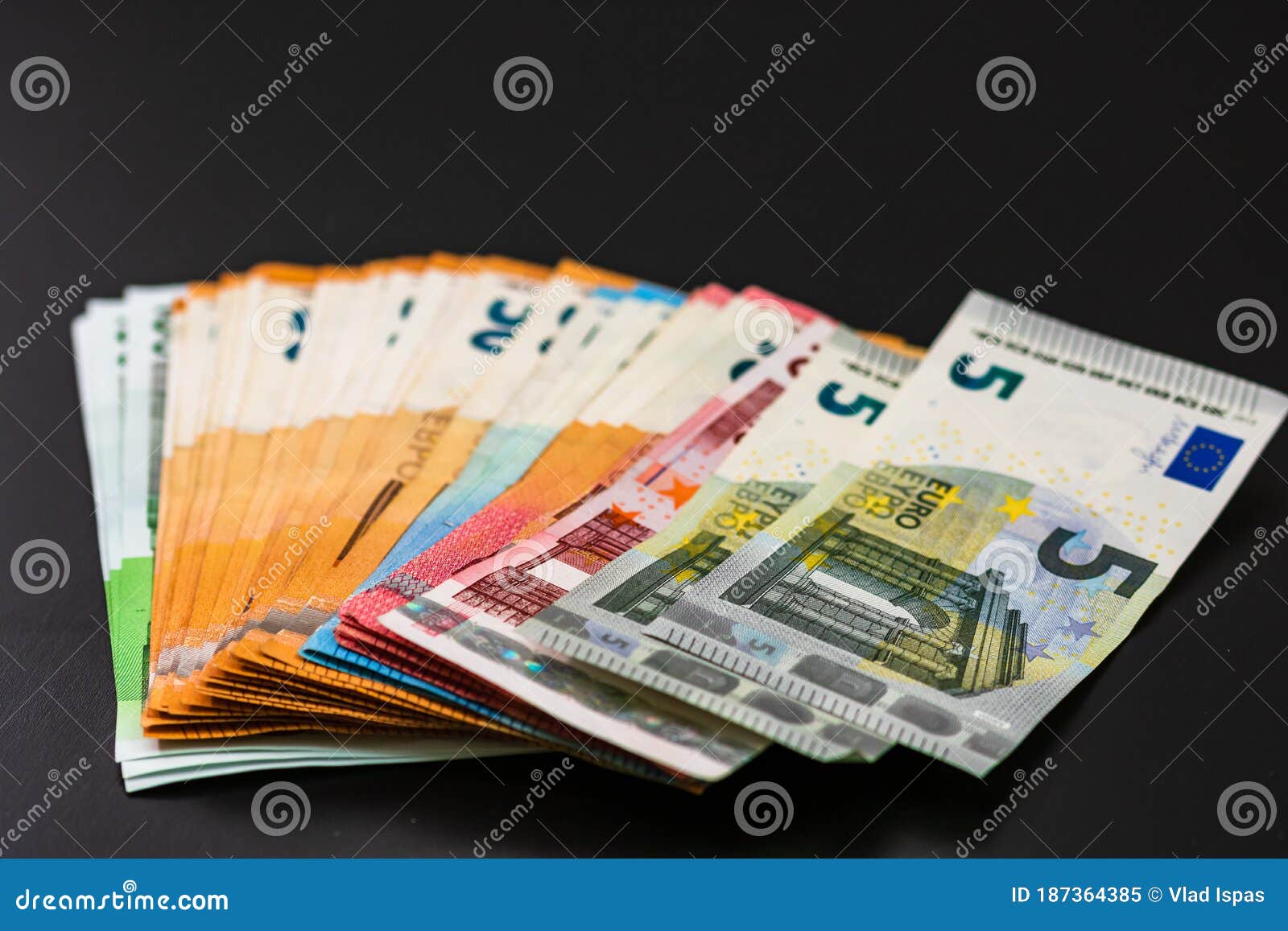 Blurred Money on the Table, EURO on Black Table. Business Concept Stack ...