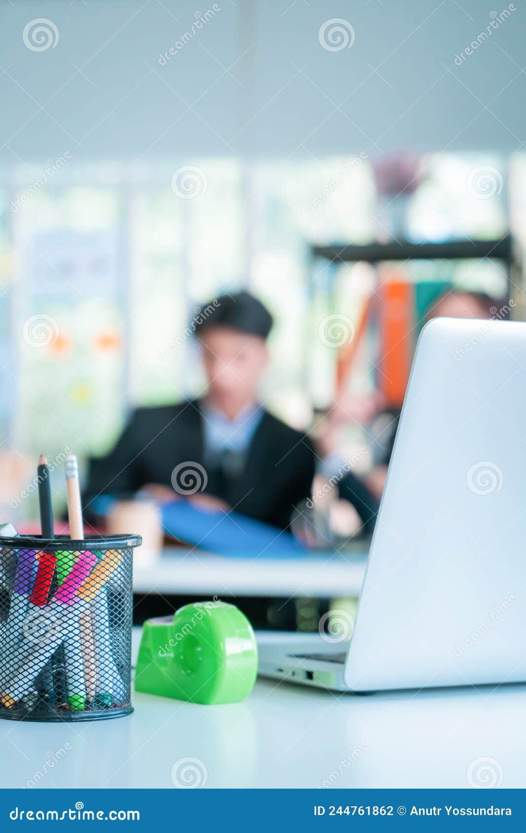 Blurred Office Workers Working Background with Office Desk and Laptop ...