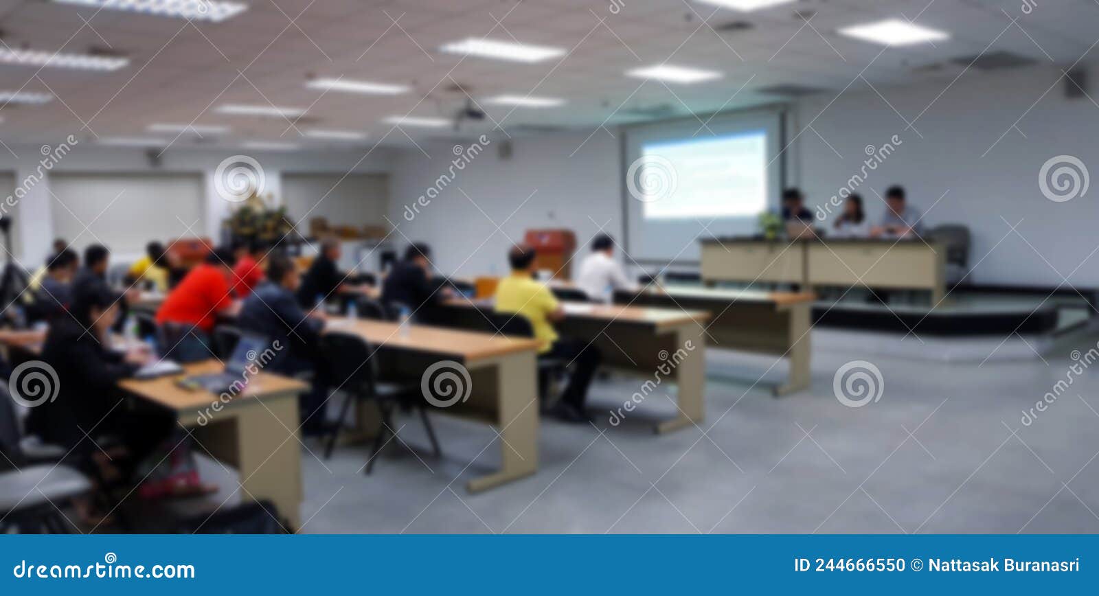 Blurred of People Training in Room with Three Instructors, Listener and ...