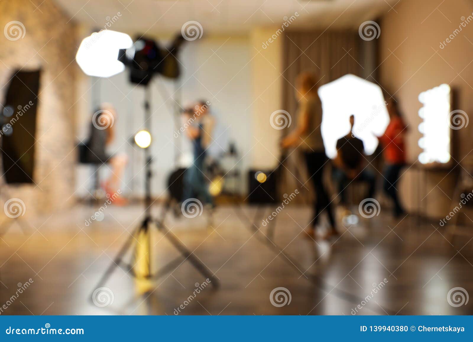 Blurred Photo Studio with Professional Equipment and Team Stock Photo ...
