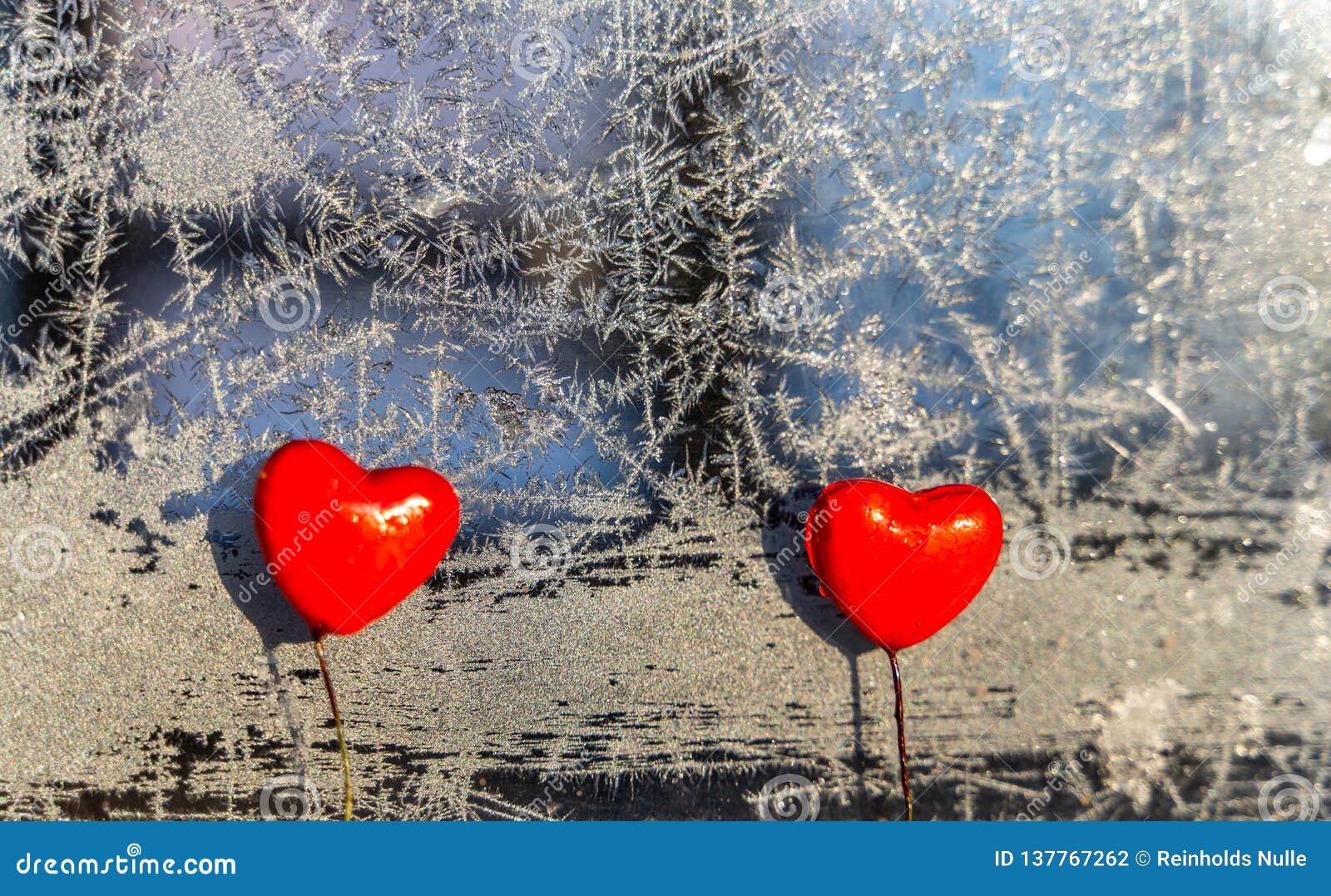Blurred Read Heart Decorations on the Foreground of Window with ...