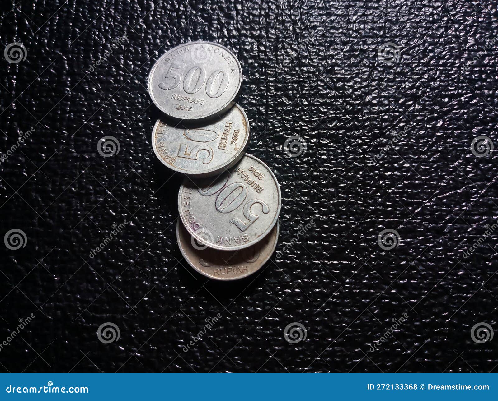 Blurred 500 Rupiah Coins, Indonesian Currency on Black Surface Stock ...