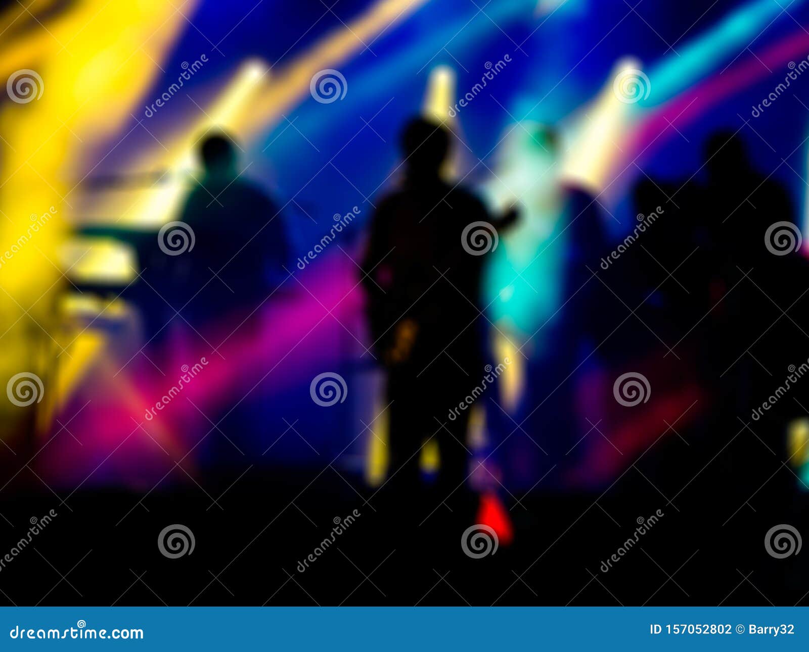 Blurred Silhouette of Band Playing on a Stage with Colored Lights Stock ...