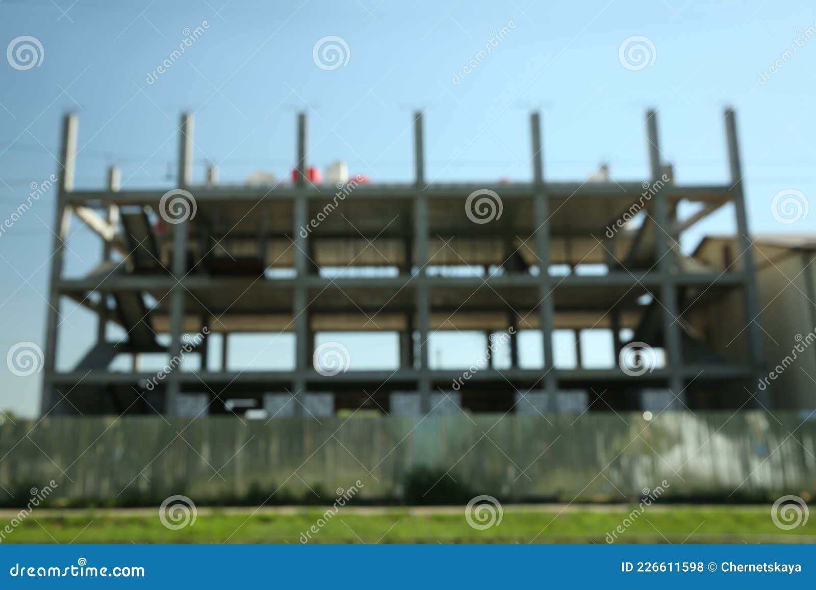 Blurred View of Unfinished Building Against Blue Sky Stock Photo ...