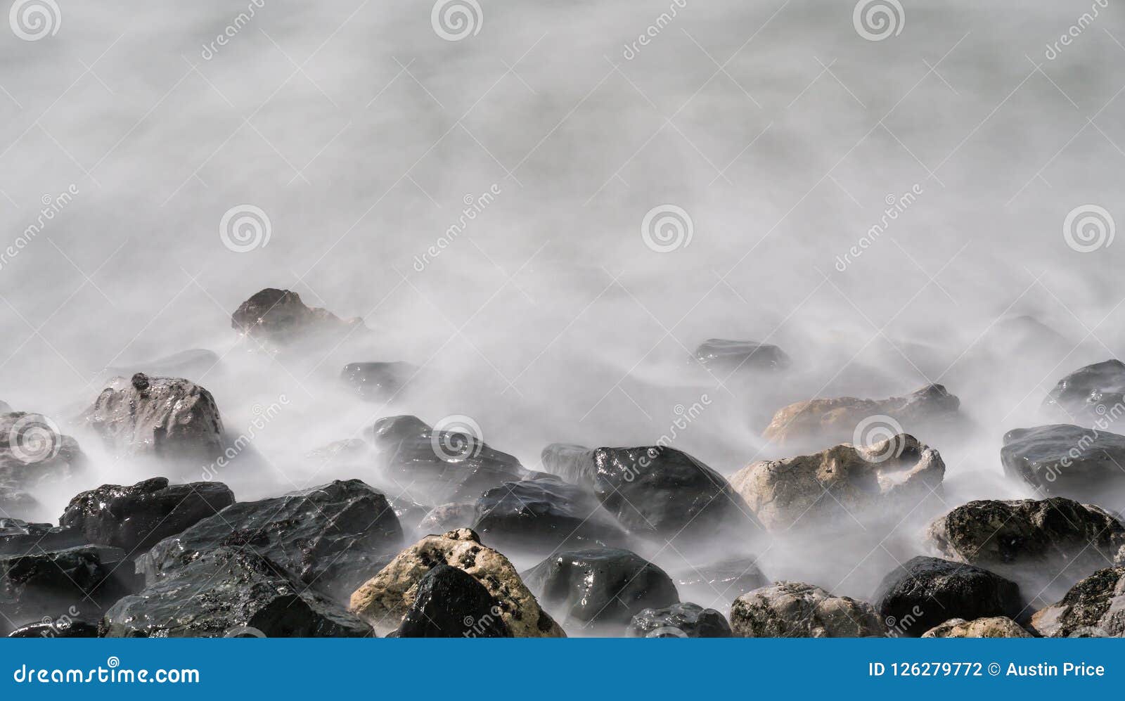 Blurred Water Over Rocks stock photo. Image of ocean - 126279772
