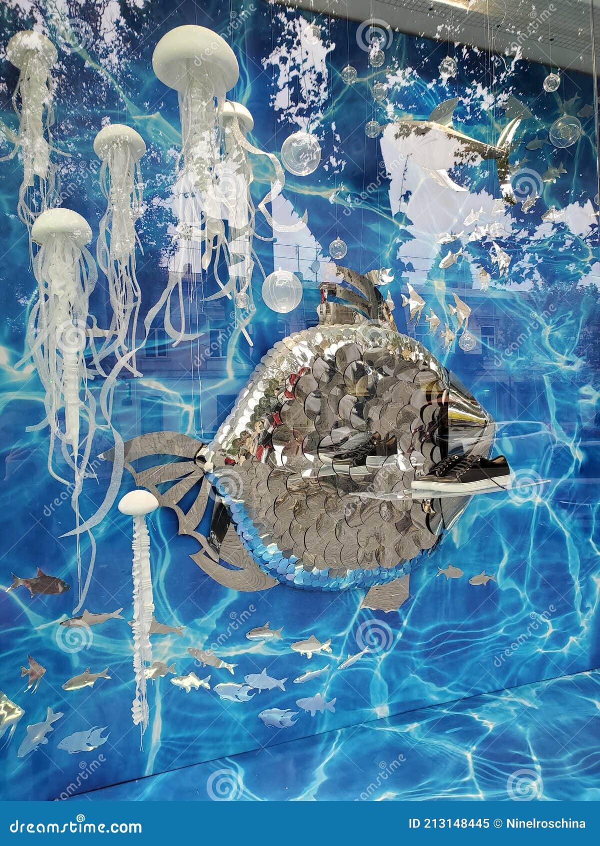 Blurry Distorted Reflections in Showcase Decorated As Underwater World ...