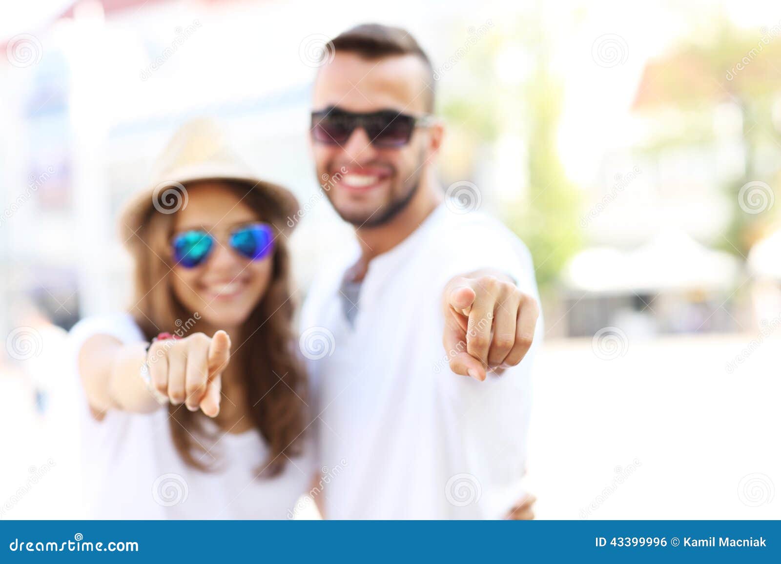 Blurry Portrait of a Couple Pointing To the Camera Stock Photo - Image ...