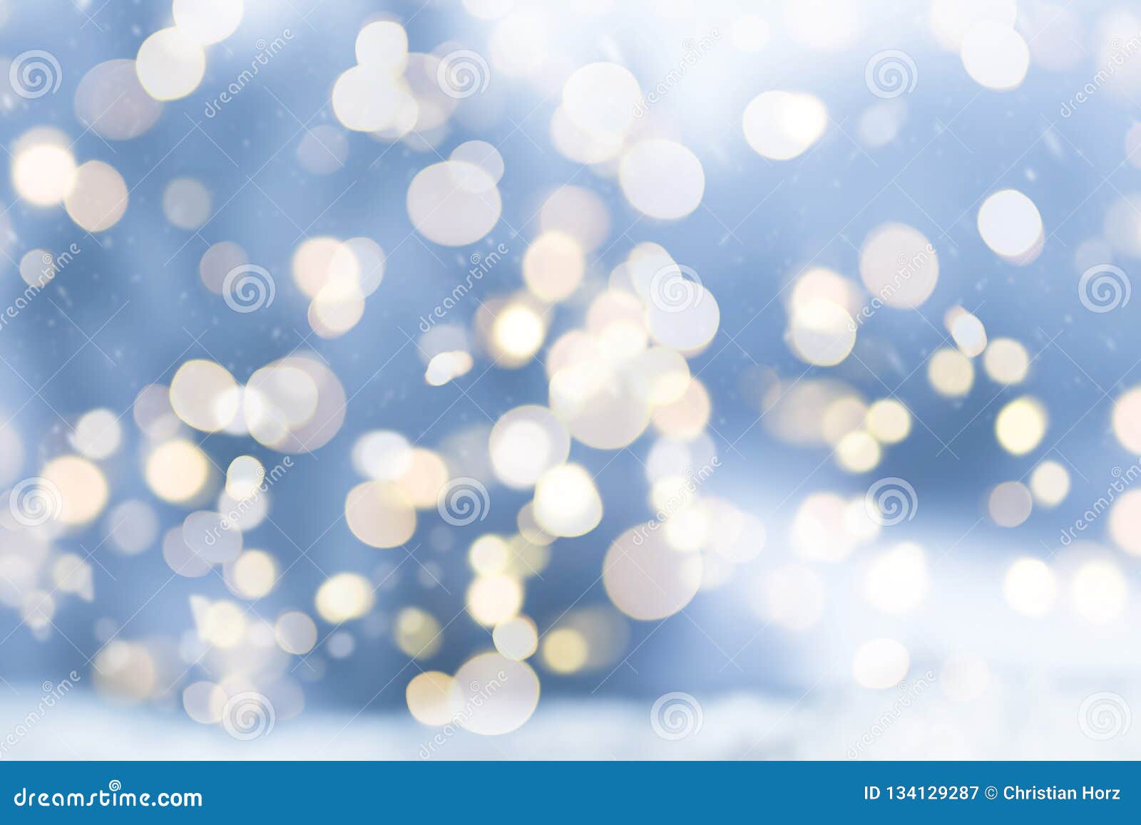 Blurry Snowy Winter Christmas Background with Circular Bokeh Lights ... Blurry Snowy Winter Christmas Background with Circular Bokeh Lights ...