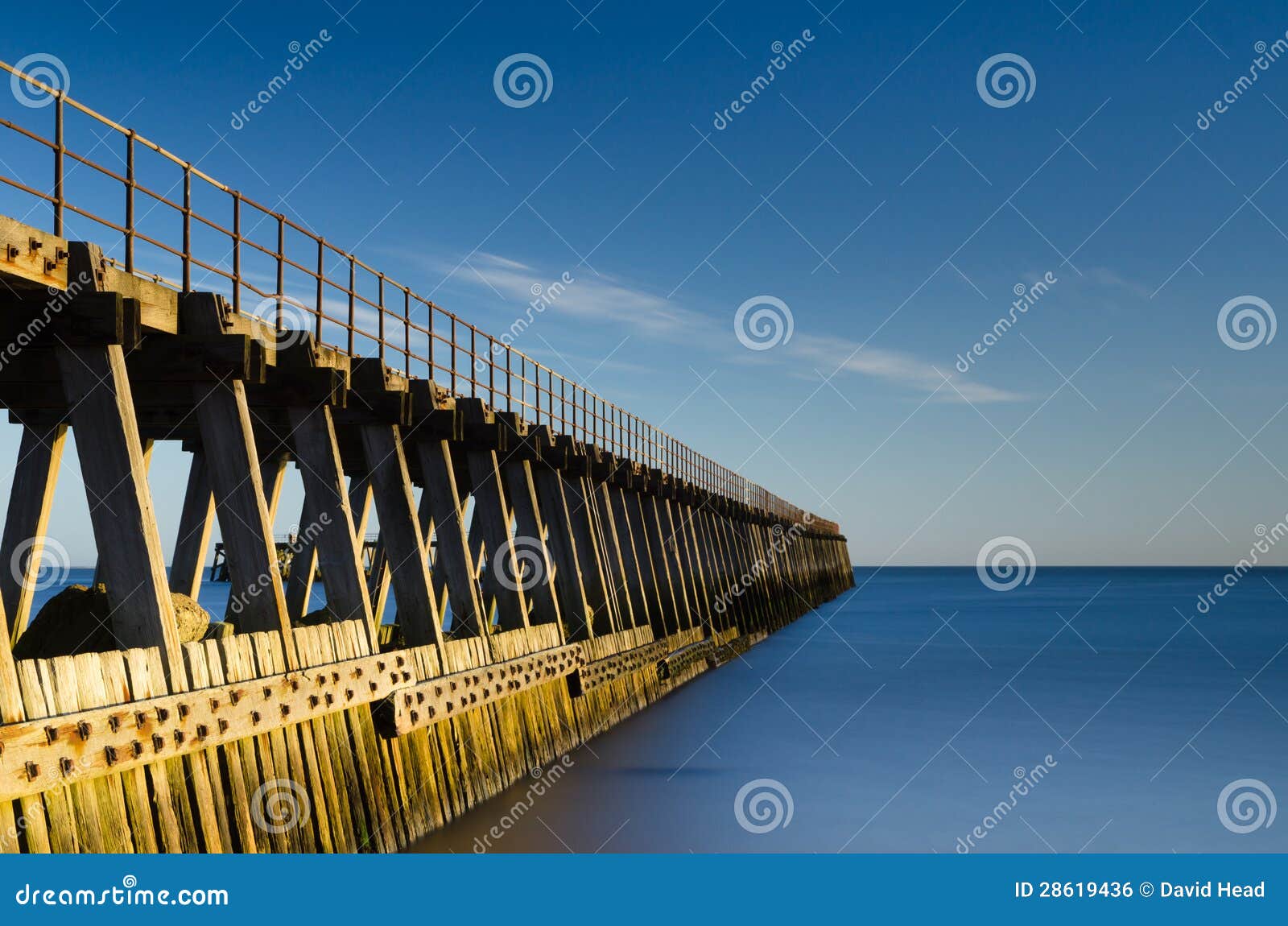 Blyth pier in smooth water stock photo. Image of east - 28619436