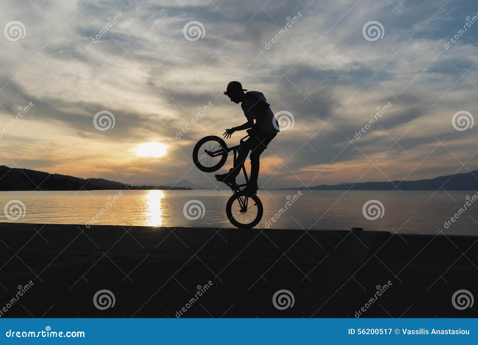 Bmx Biker Silhouette Doing Tricks Against the Sunset. Stock Image ...