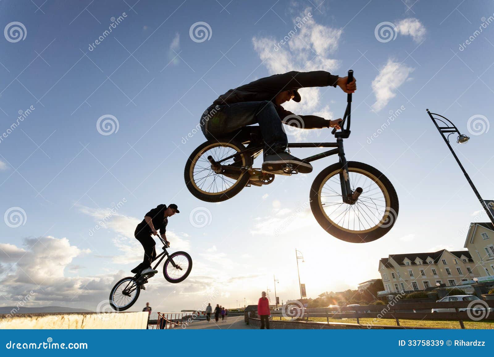 BMX stunts at the street stock image. Image of clouds - 33758339