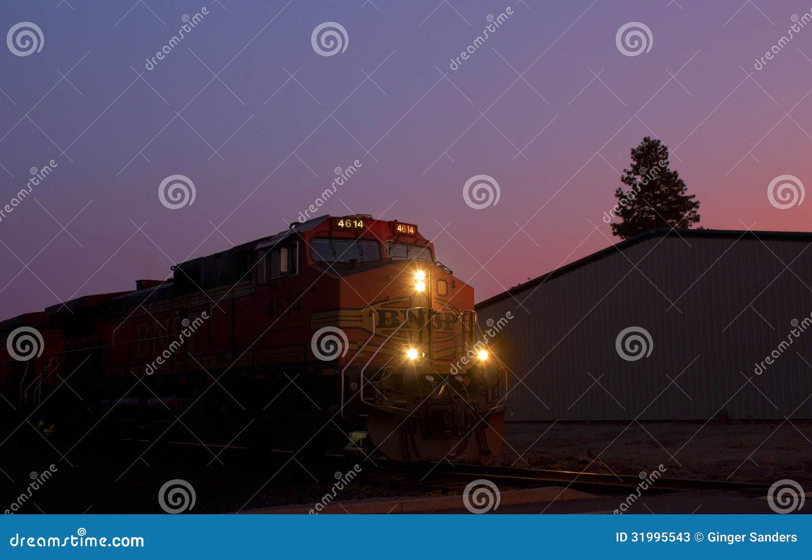 Orange BNSF Railroad Freight Train Engine Stopped At Rural Intersection ...