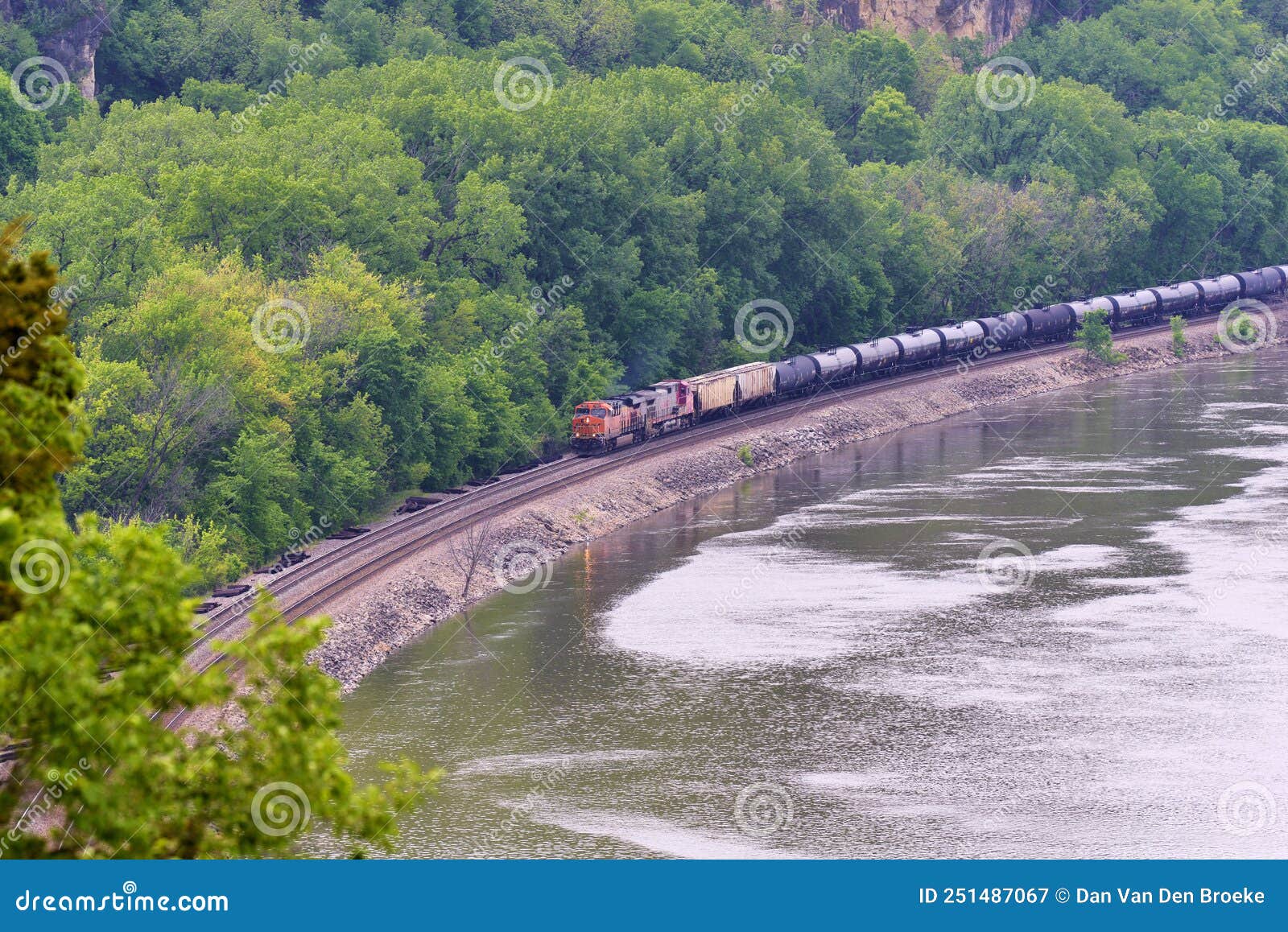 BNSF Train Engine Pulling a String of Tank Cars Along the Mississippi ...