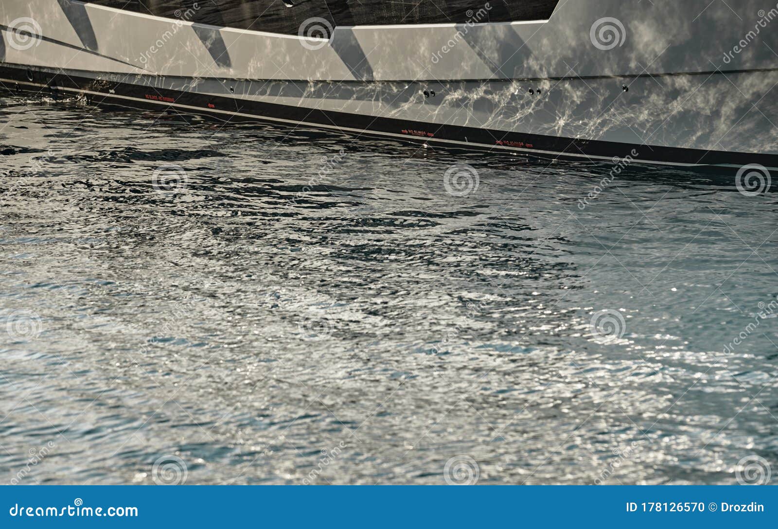 Board of the Big Boat of Grey Color, Reflections of the Sun on Water at ...