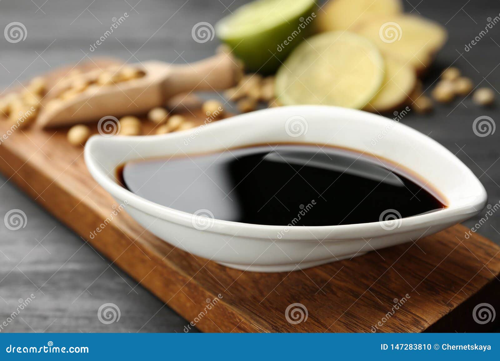 Board with Dish of Soy Sauce on Table Stock Photo - Image of oriental ...