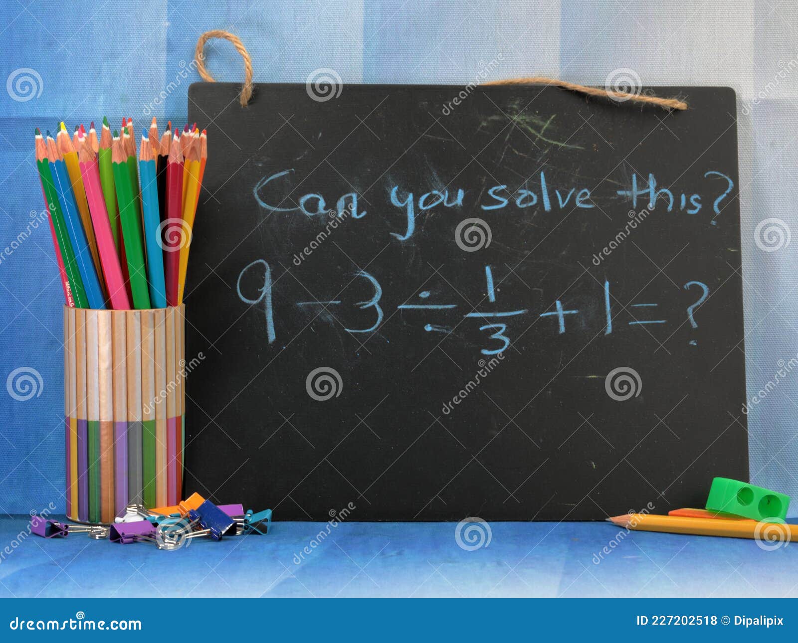 A Board with a Mathematical Equation To Solve with School Supplies ...