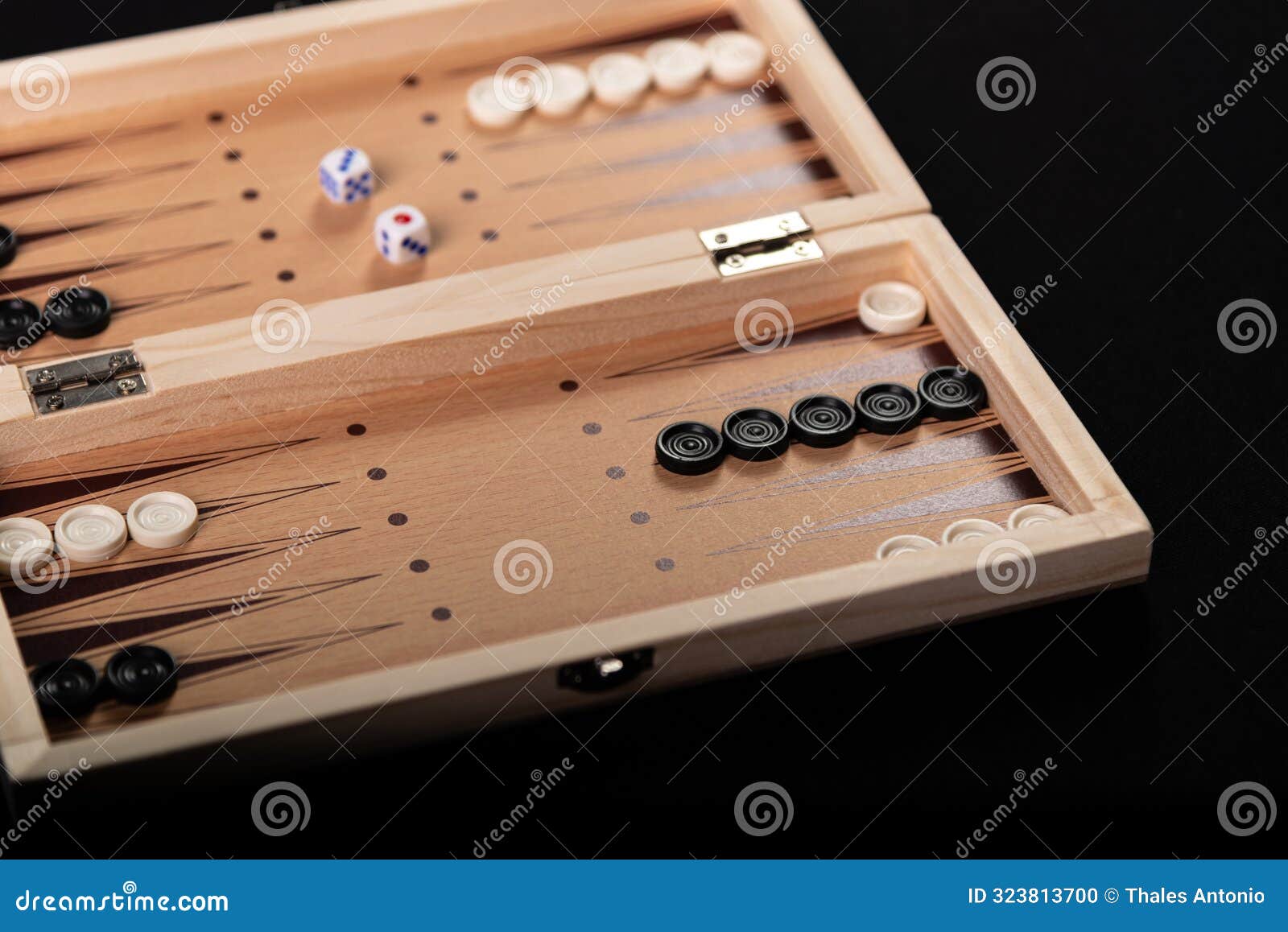 Board for Playing Backgammon with Pieces and Dice on a Black Background ...