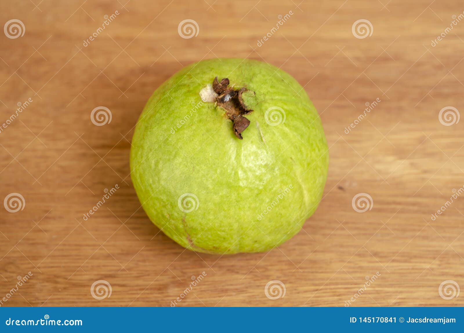 A Round Guavas on Board Surface Stock Image - Image of diet, isolated ...