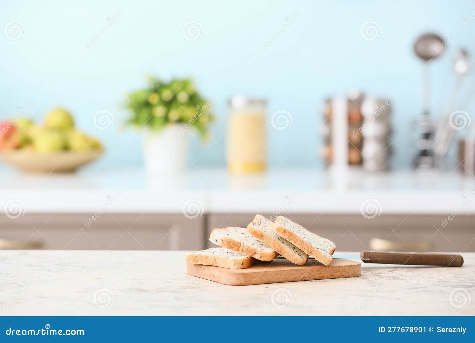Board with Toasts and Knife on Table in Modern Kitchen Stock Image ...