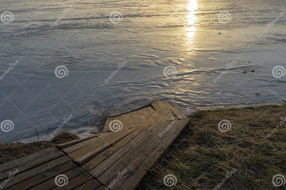Boardwalk at the Edge of a Lake at Sunset Stock Photo - Image of frozen ...
