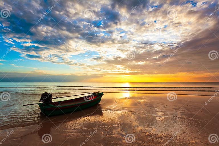 Boat on the Beach at Sunset Stock Photo - Image of evening, orange ...