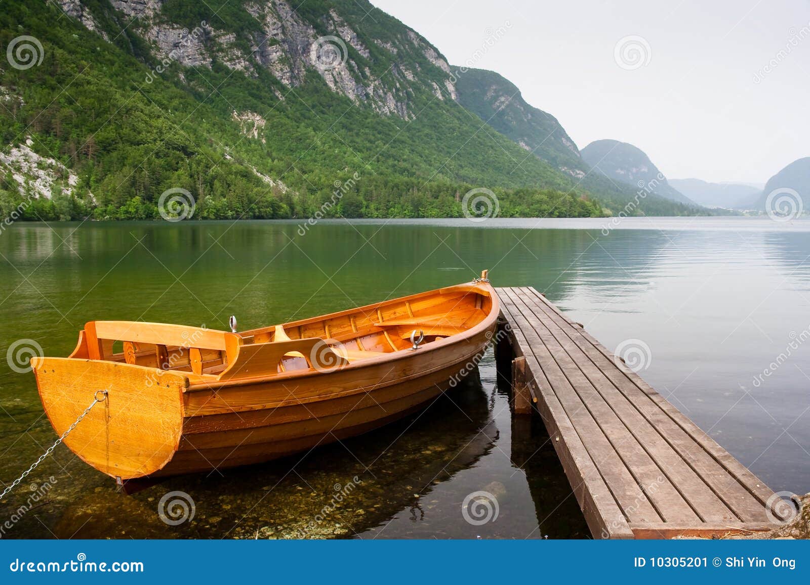 Boat Berth by the Tranquil Lake Pier with Mountain Stock Image - Image ...
