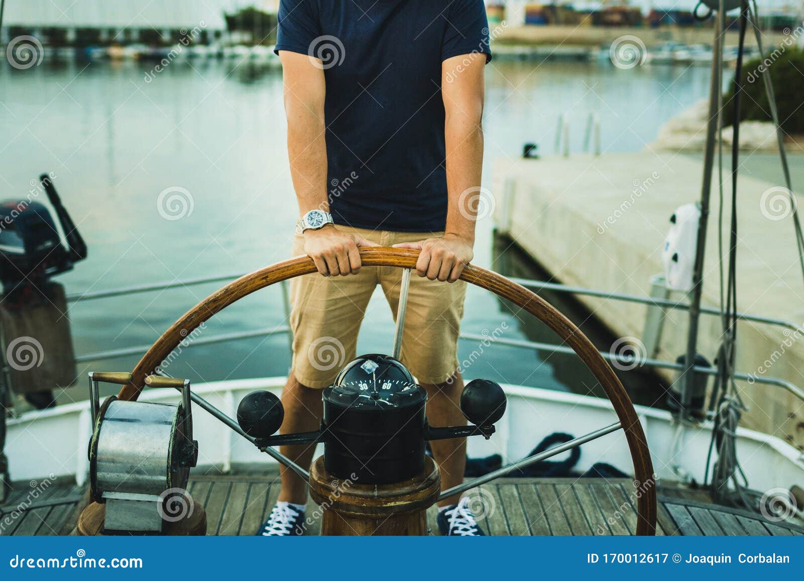 Boat Captain at the Helm Leaving Port Stock Image - Image of person ...