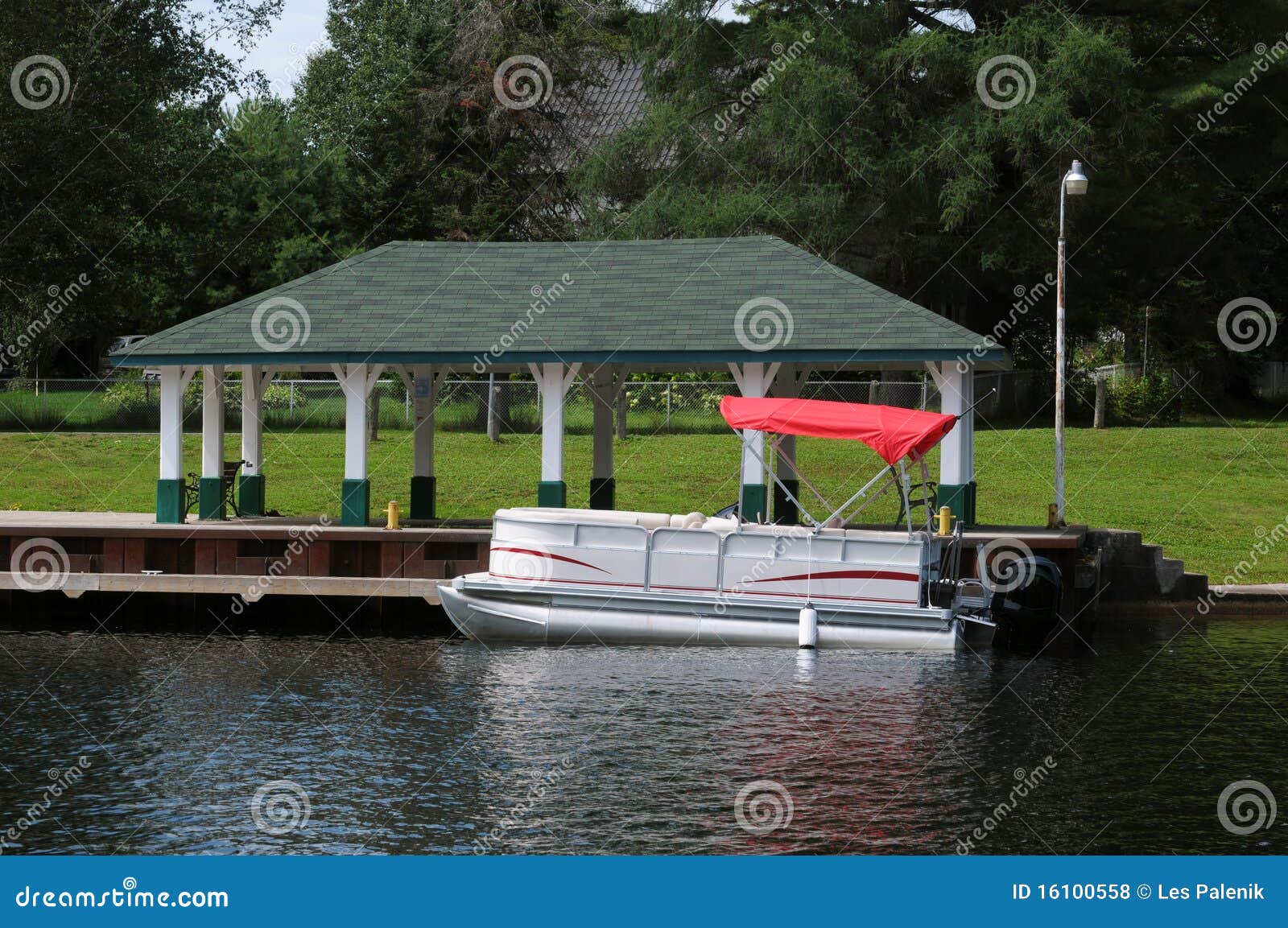 Boat at the covered dock stock photo. Image of boat, roof - 16100558