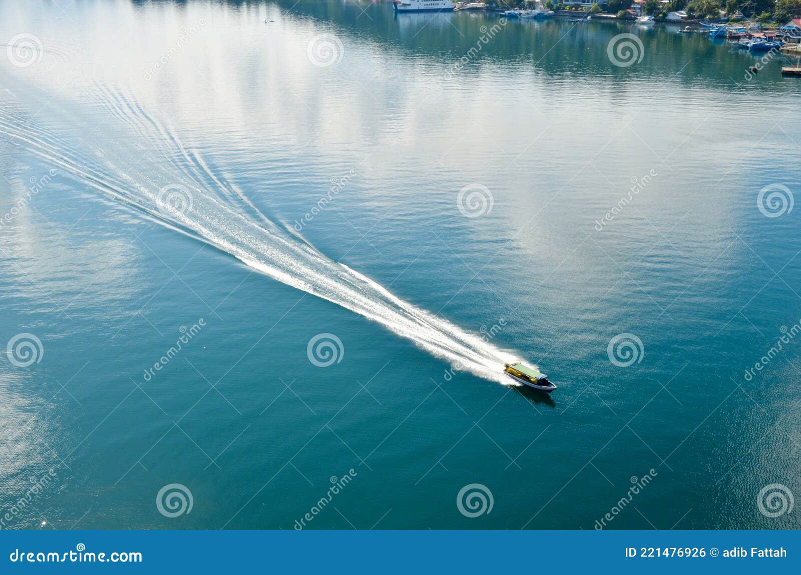 A Boat Crosses the Ocean Fast Stock Photo - Image of crosses, water ...