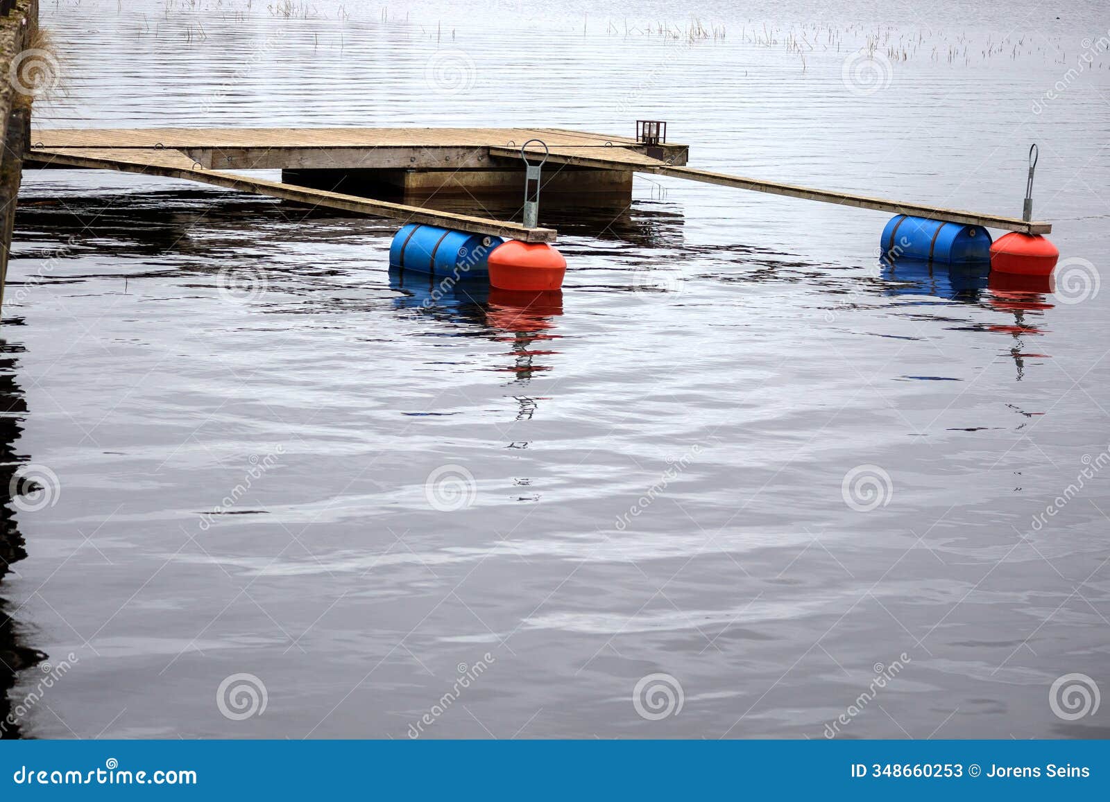 .a Boat Dock with a Boardwalk and Buoys on the Water Stock Image ...