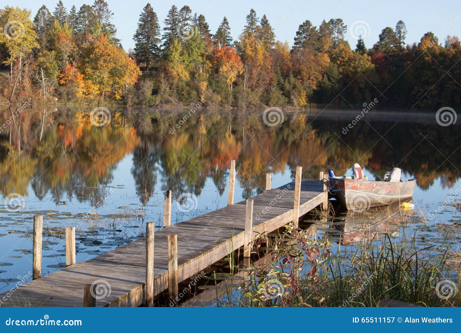 Boat Dock and Boat in the Fall Stock Image - Image of blue, lake: 65511157