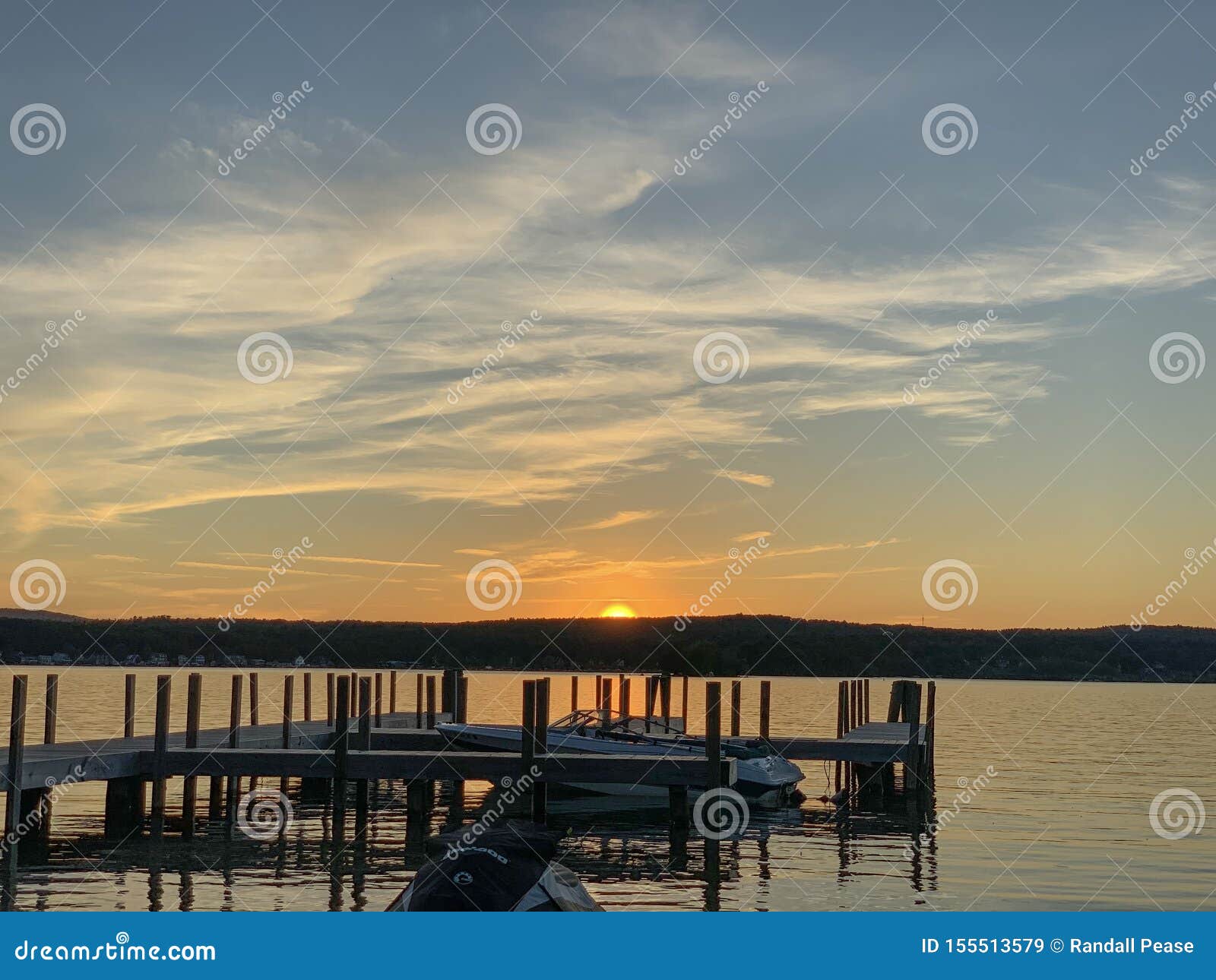 Lake dock at sunset stock image. Image of dock, sunset - 155513579